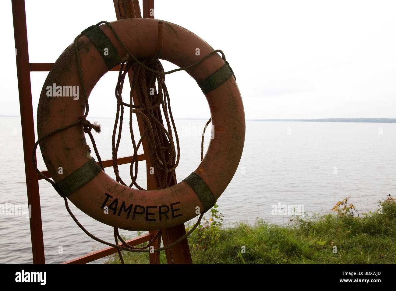 A lifebelt (lifebuoy) is attached to a ladder by Nasijarvi Lake, to the ...