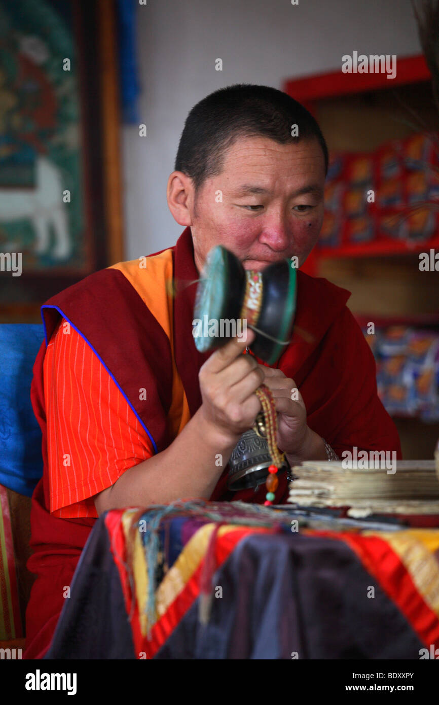 Child monk playing a shell at reading ceremony , Mongolia Stock Photo ...