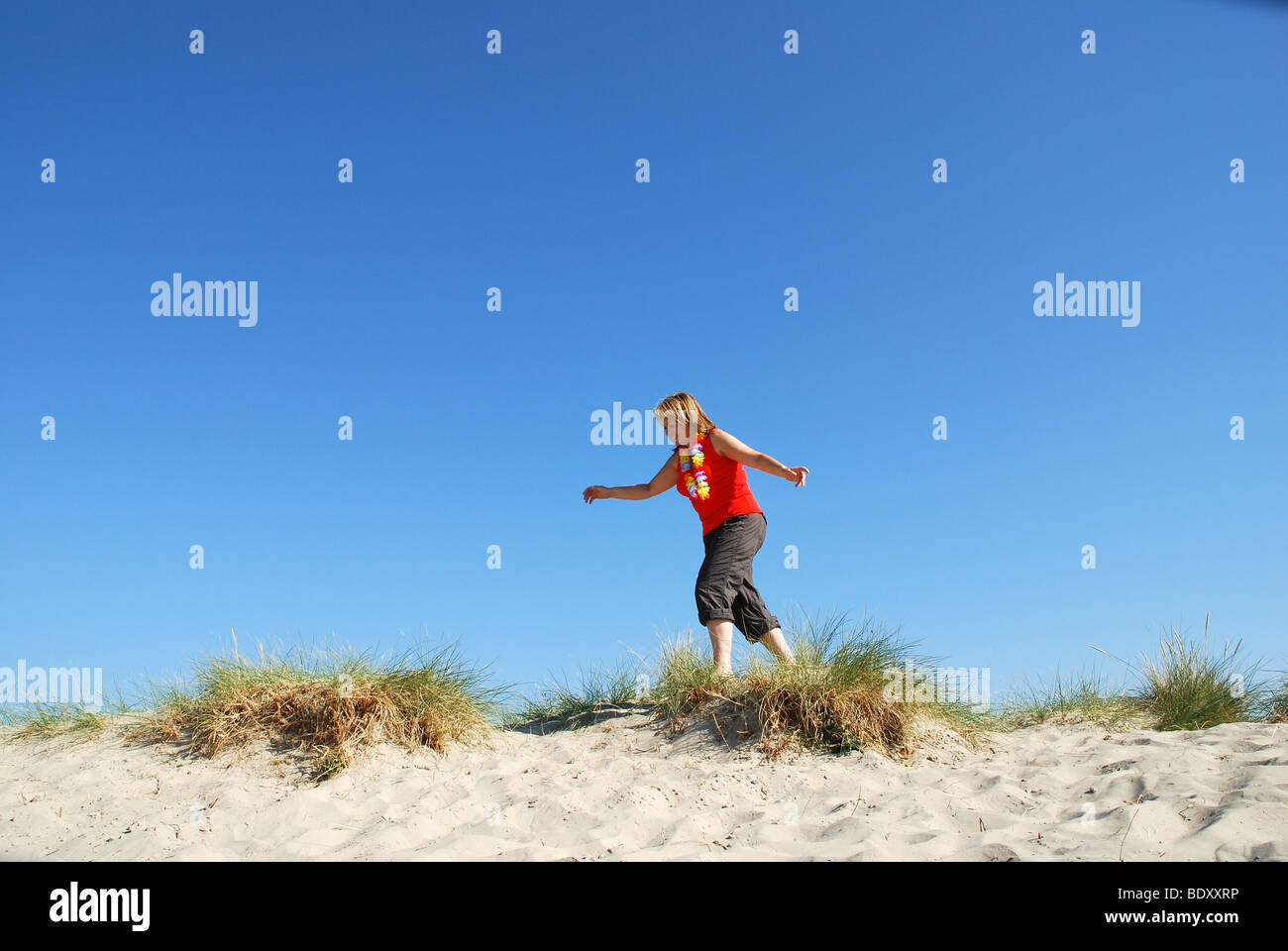 Mature woman beach joy jump hi-res stock photography and images - Alamy