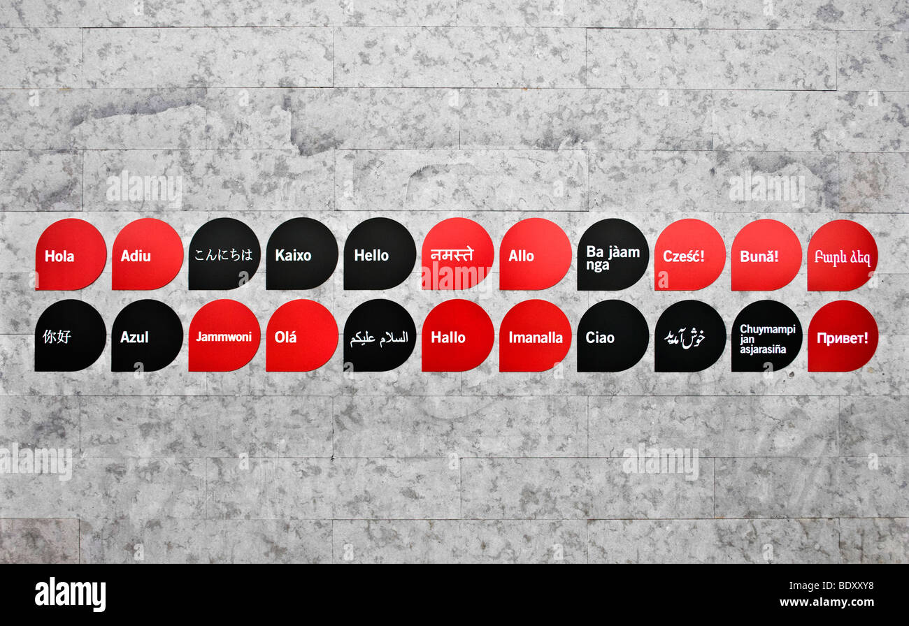 'Hello' in different languages. Signs on wall of building Stock Photo ...