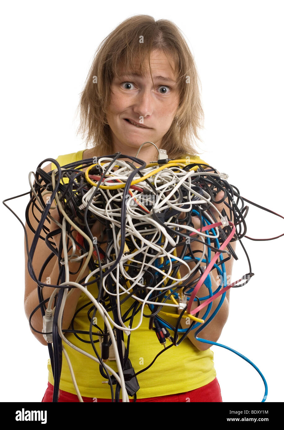 crazy woman with tangle of cables and wires in hands isolated on white ...