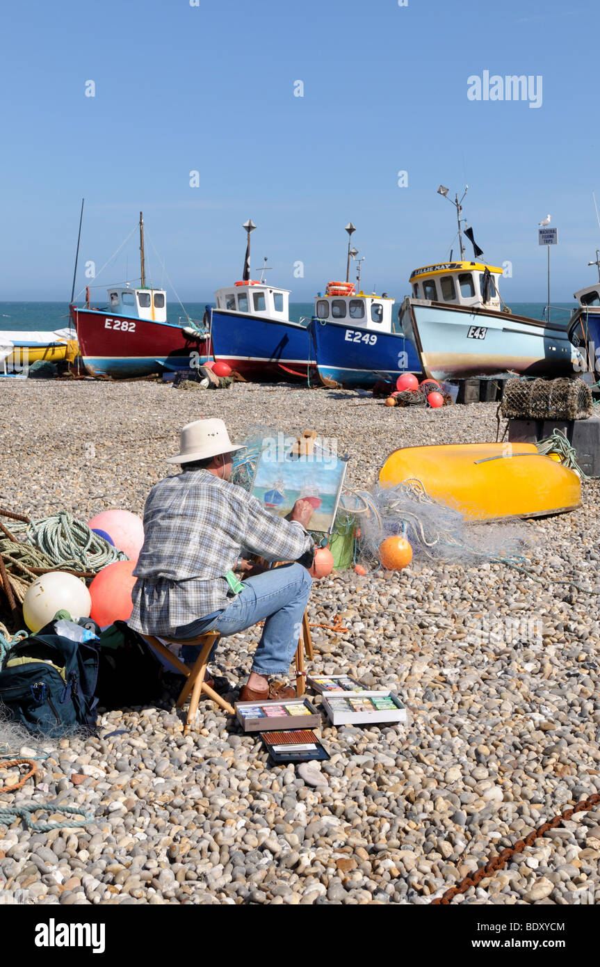 Artist painting on the beach at Beer Devon England Stock Photo - Alamy