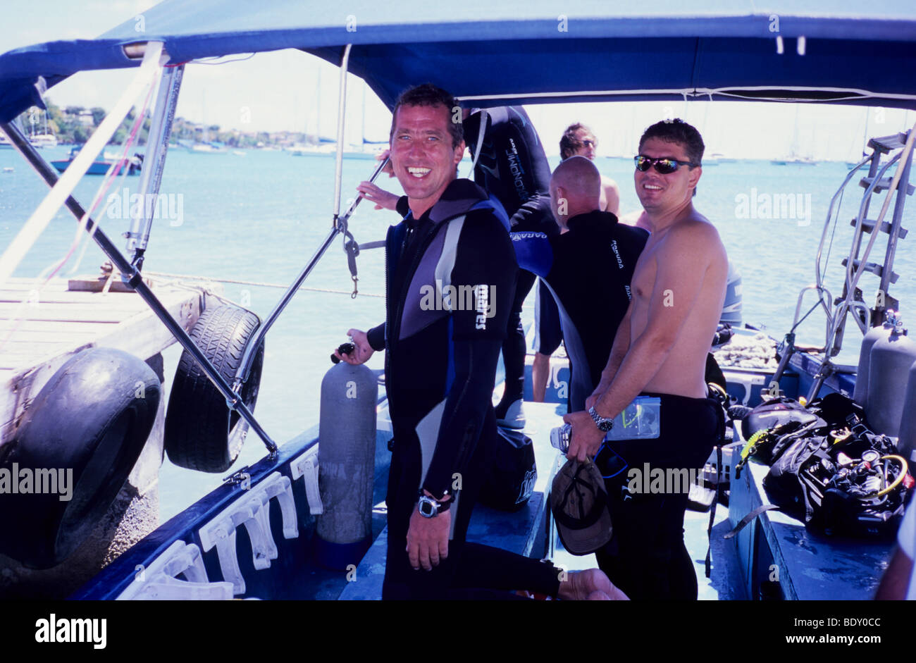 ScubaTech dive boat arrives back at the jetty, near the Calabash Hotel ...