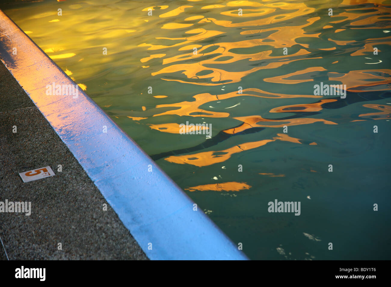 Light reflecting on swimming pool Stock Photo - Alamy