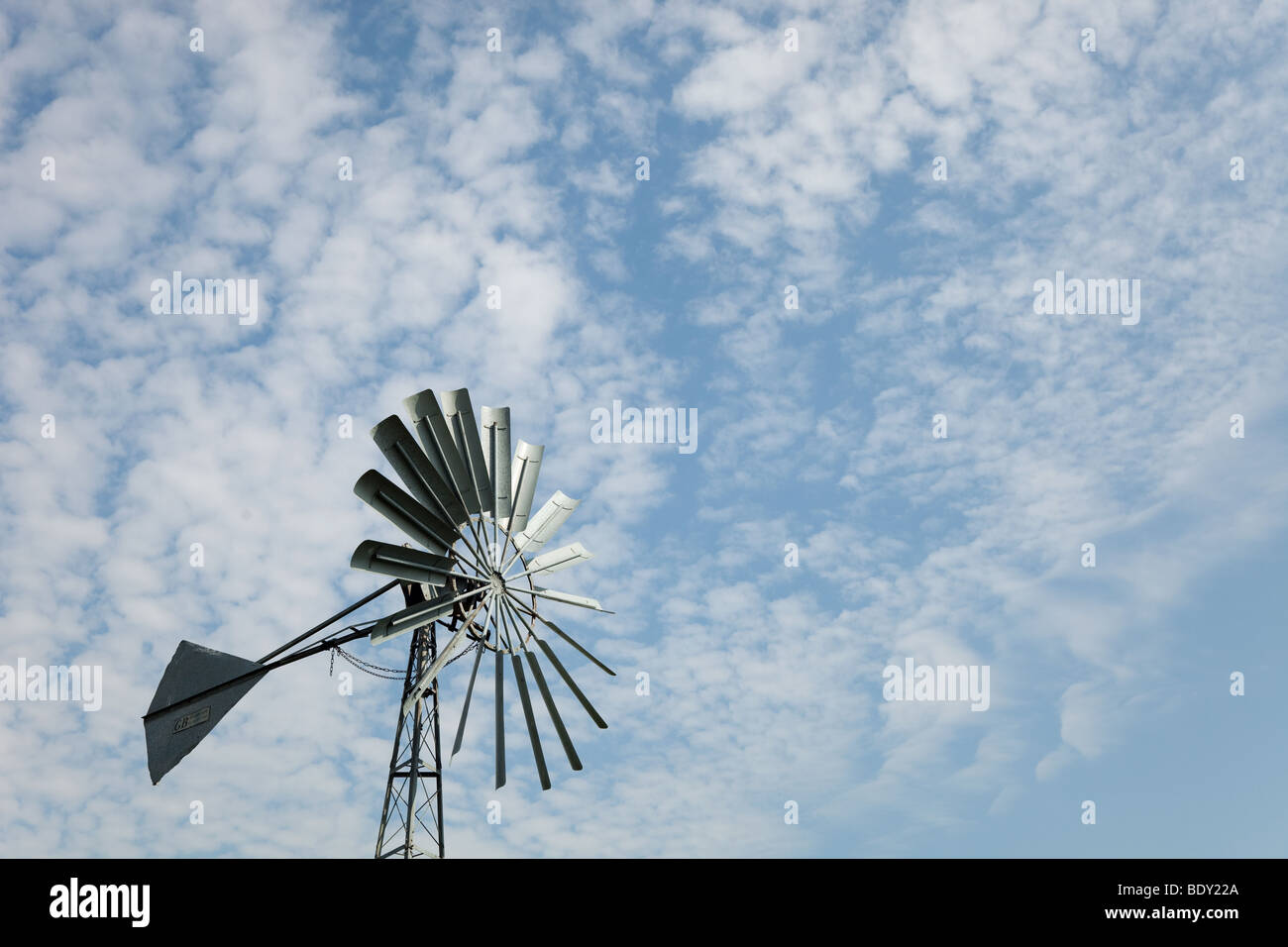 Wind pump with sky background Stock Photo - Alamy