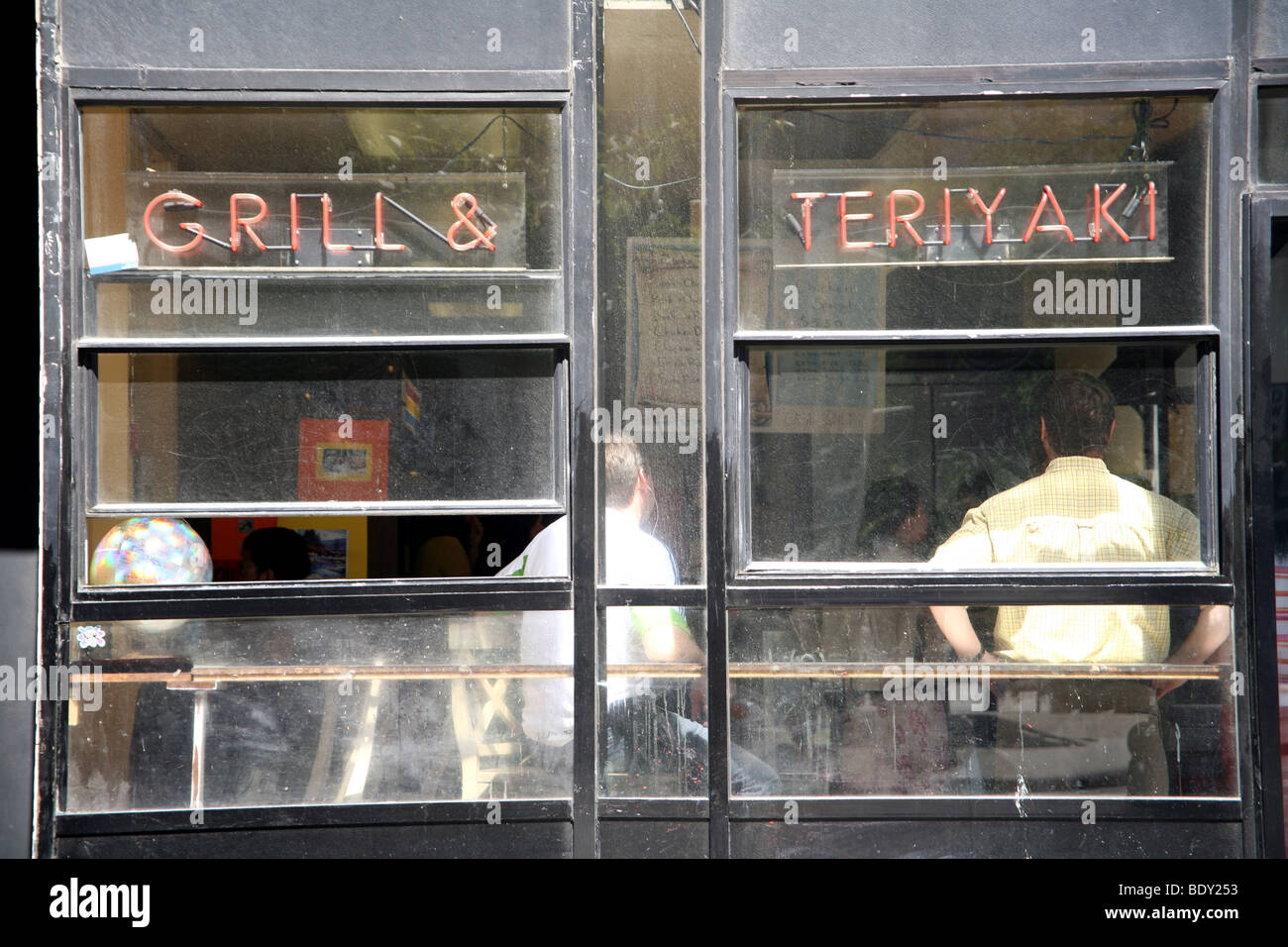 Exterior view of people waiting in line at teriyaki restaurant Stock ...