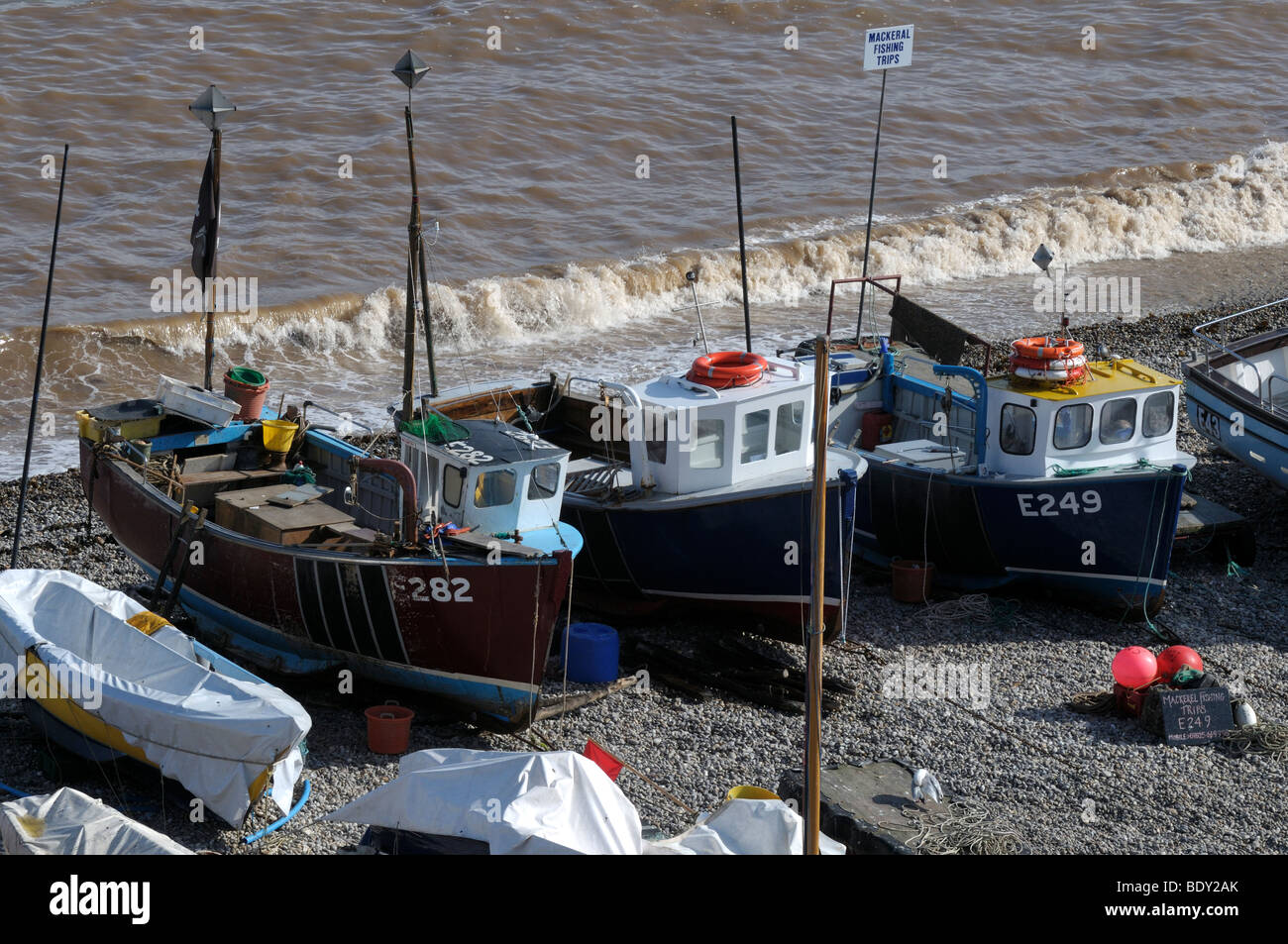 Fishing boats on beach at Beer Devon England Stock Photo - Alamy