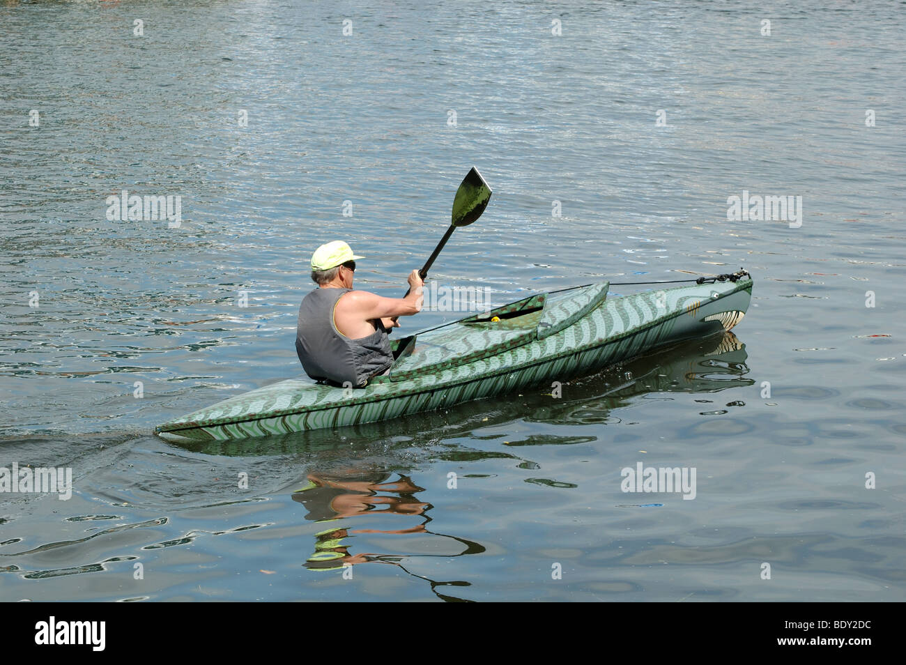 man canoeing on the River Stour, Christchurch, Dorset, England, UK ...