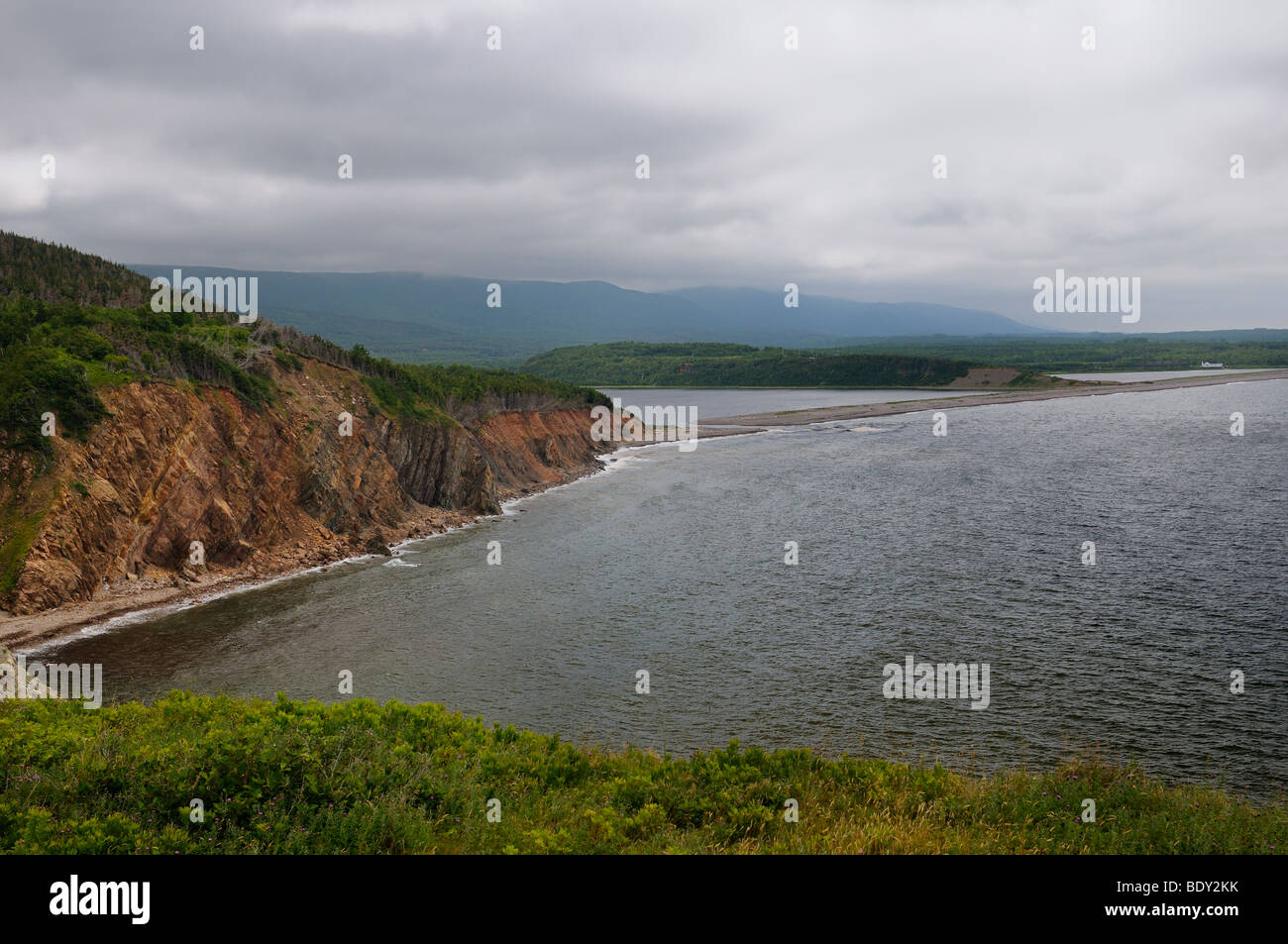 Red cliffs and sandbar at Grande Falaise on the Cabot Trail Cape Breton ...