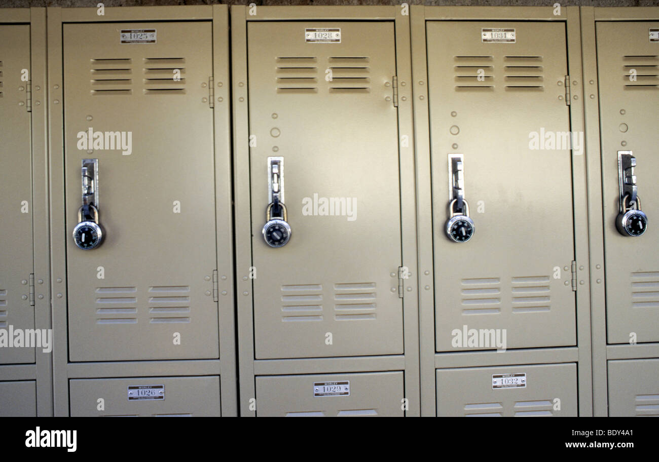 row of beige school lockers with locks on handles Stock Photo - Alamy