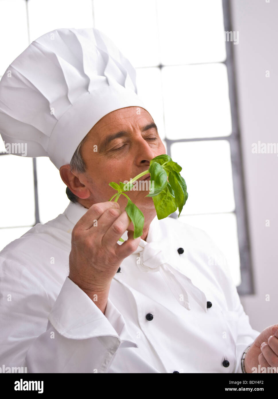 Chef wearing chefs hat smelling hi-res stock photography and images - Alamy