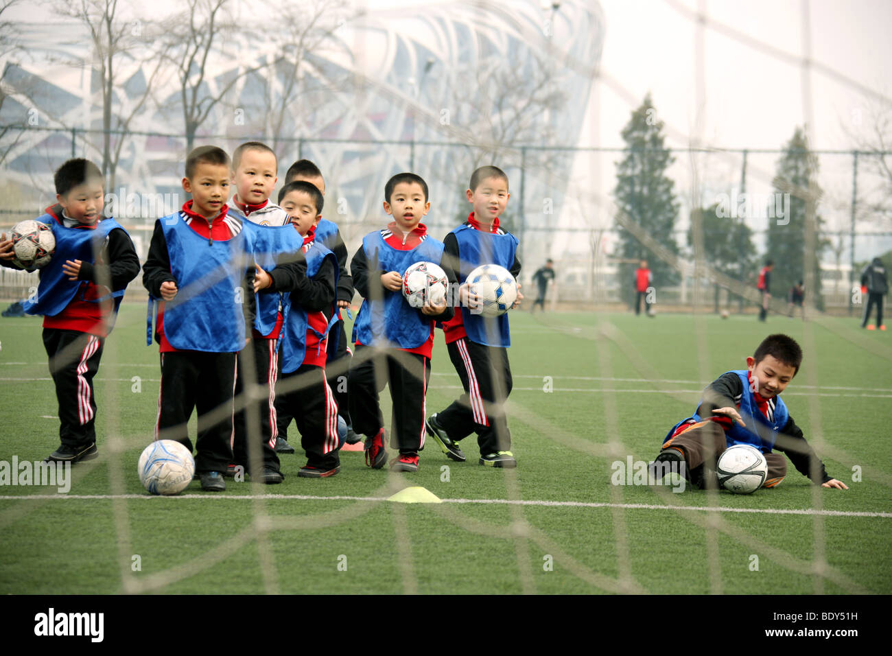 Chinese children playing football hi-res stock photography and images ...