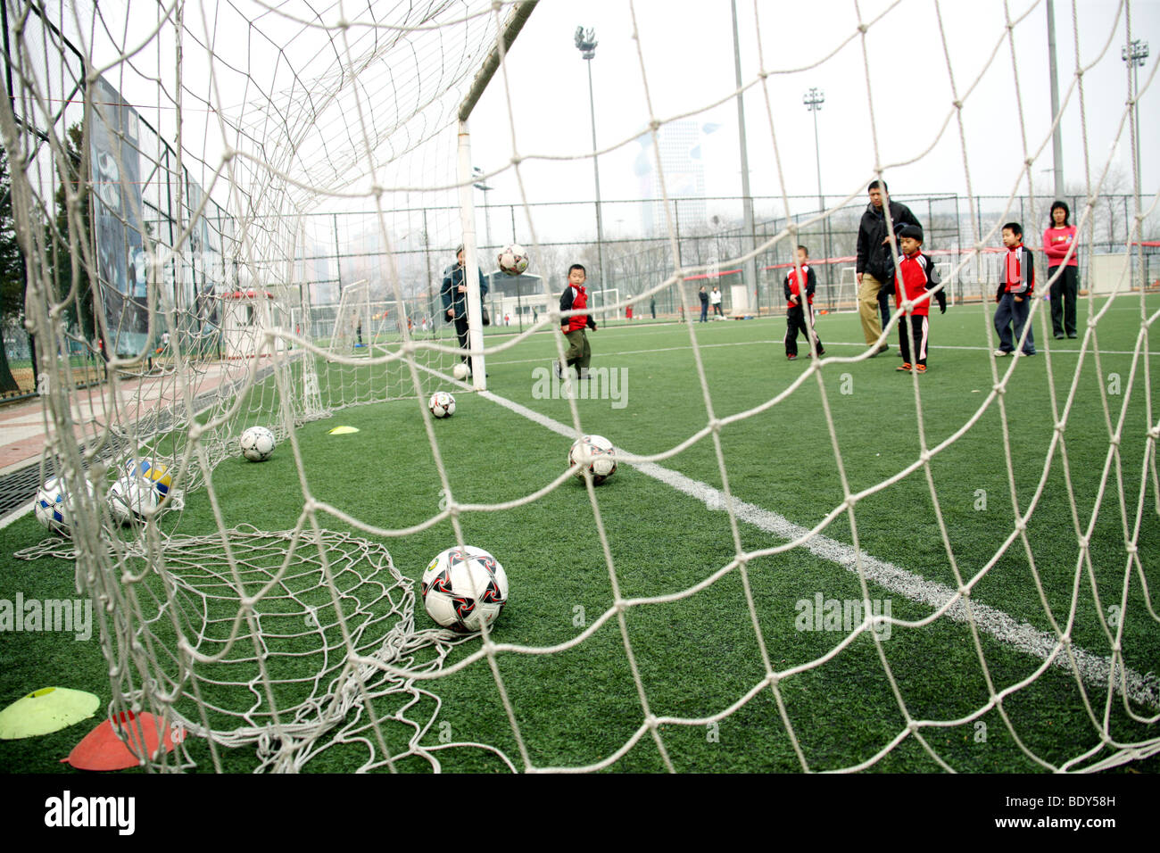 Chinese children playing football hi-res stock photography and images ...