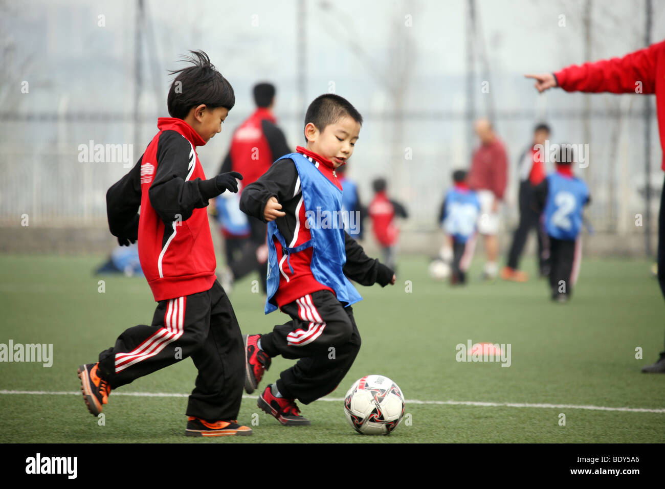 Chinese children playing football hi-res stock photography and images ...