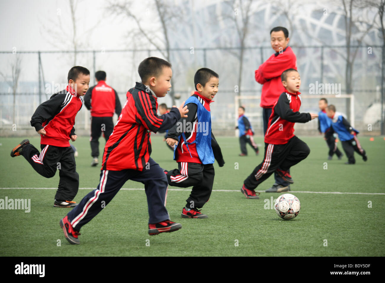 Oriental Children playing football,China Stock Photo - Alamy
