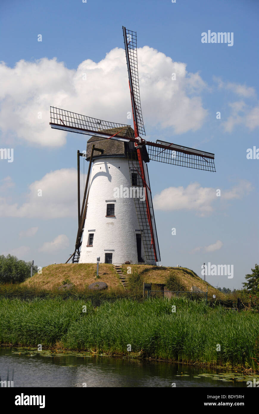 Traditional Windmill by canal in Damme, near Bruges, Belgium Stock ...