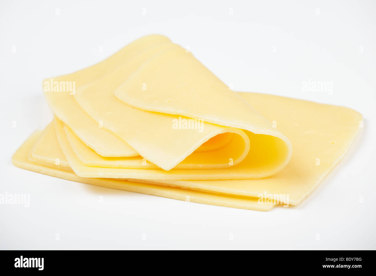 Stack of thin cheese pieces isolated on white background Stock Photo ...