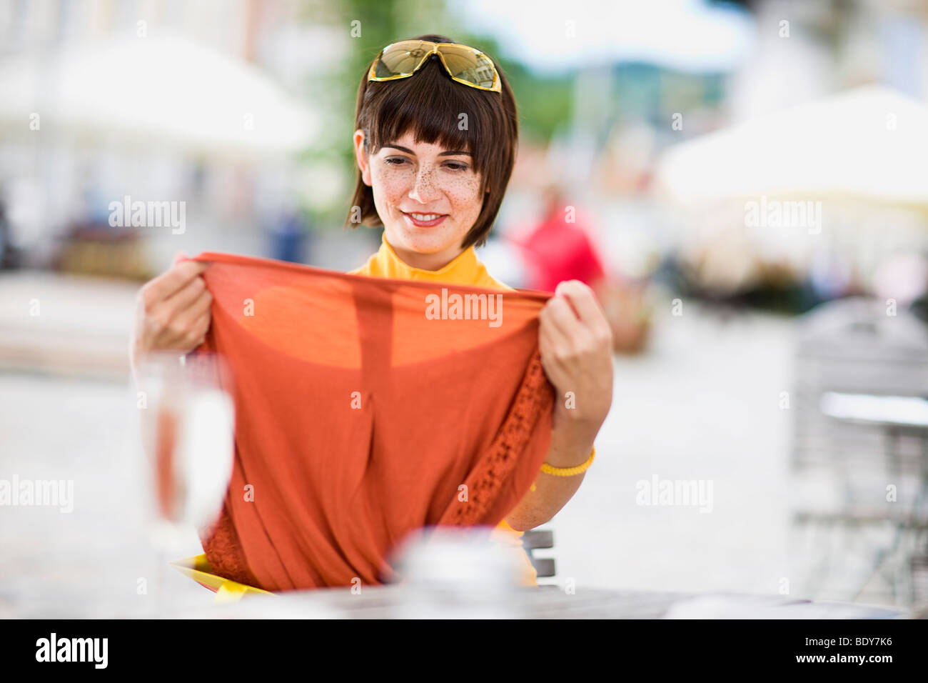 woman shows her brand new clothing Stock Photo - Alamy