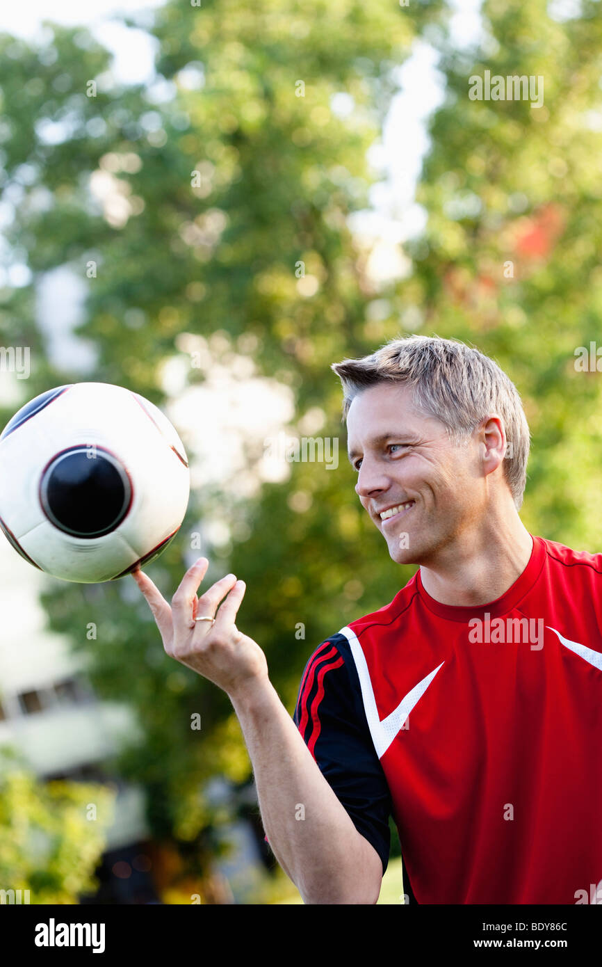Soccer Player Balancing Ball Stock Photo - Alamy