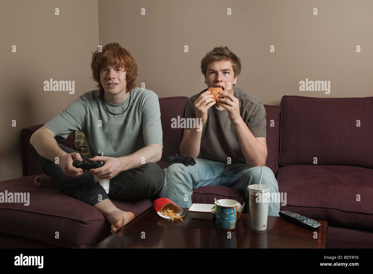 Boys playing video games Stock Photo - Alamy