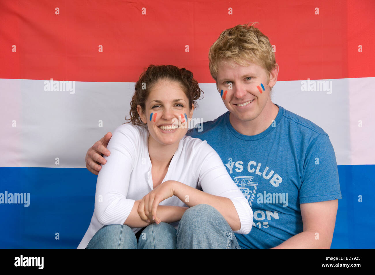Couple smiling with Dutch flag Stock Photo - Alamy