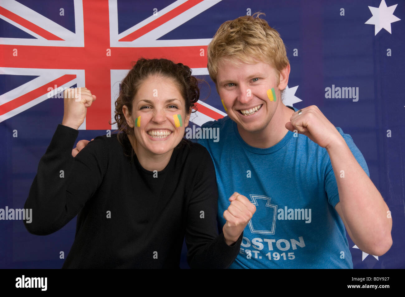 Couple smiling with Australian flag Stock Photo - Alamy