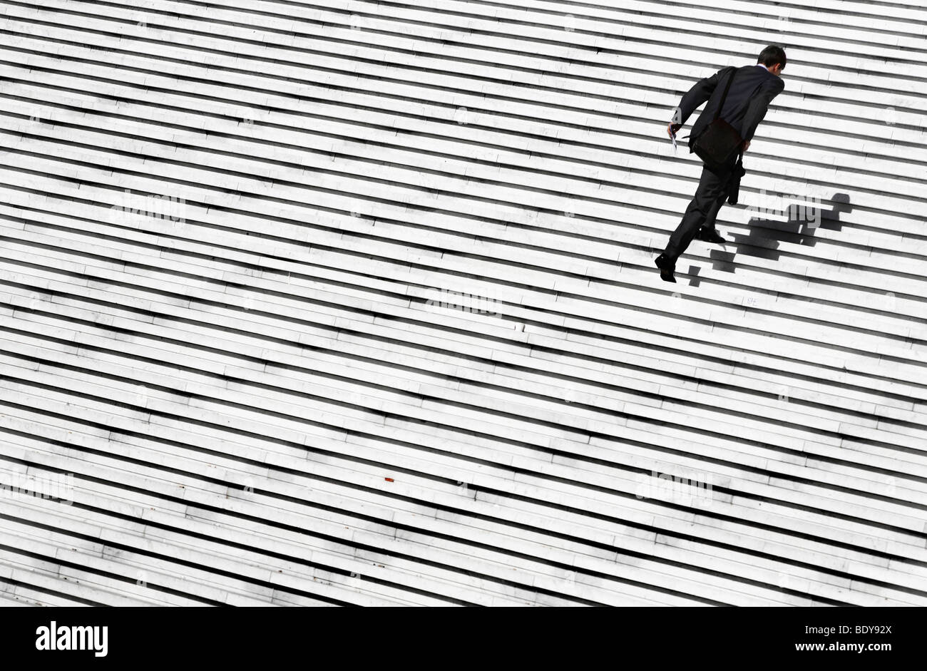 Man with a shadow running up a flight of stairs, La Grande Arche, La ...