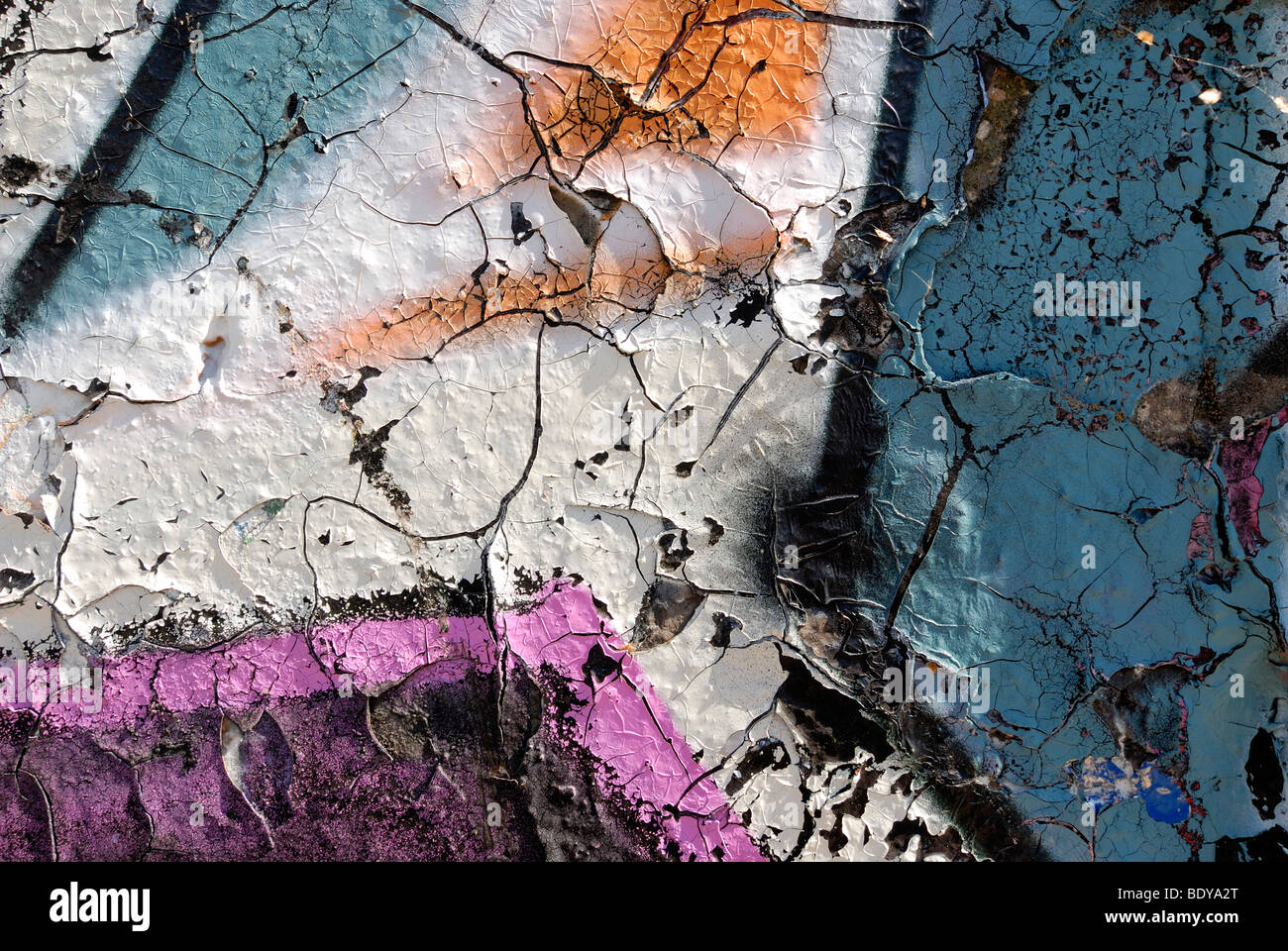 Graffiti bursting off concrete wall, art on the Berlin Wall, East Side ...