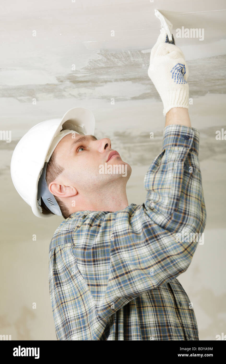 Contractor pargets the ceiling Stock Photo - Alamy