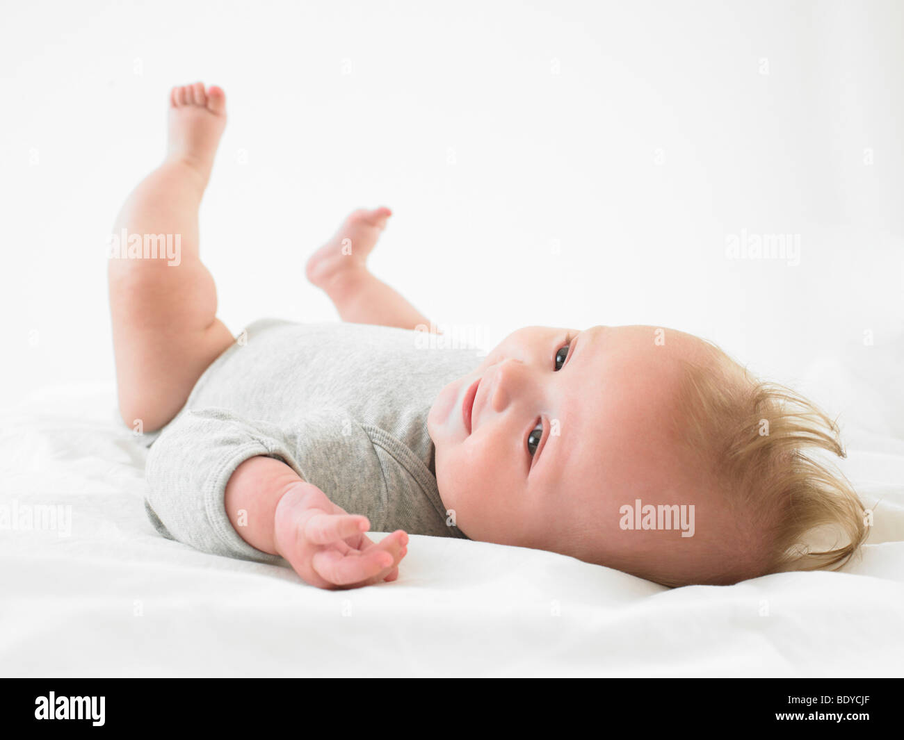 baby on back, smiling Stock Photo - Alamy
