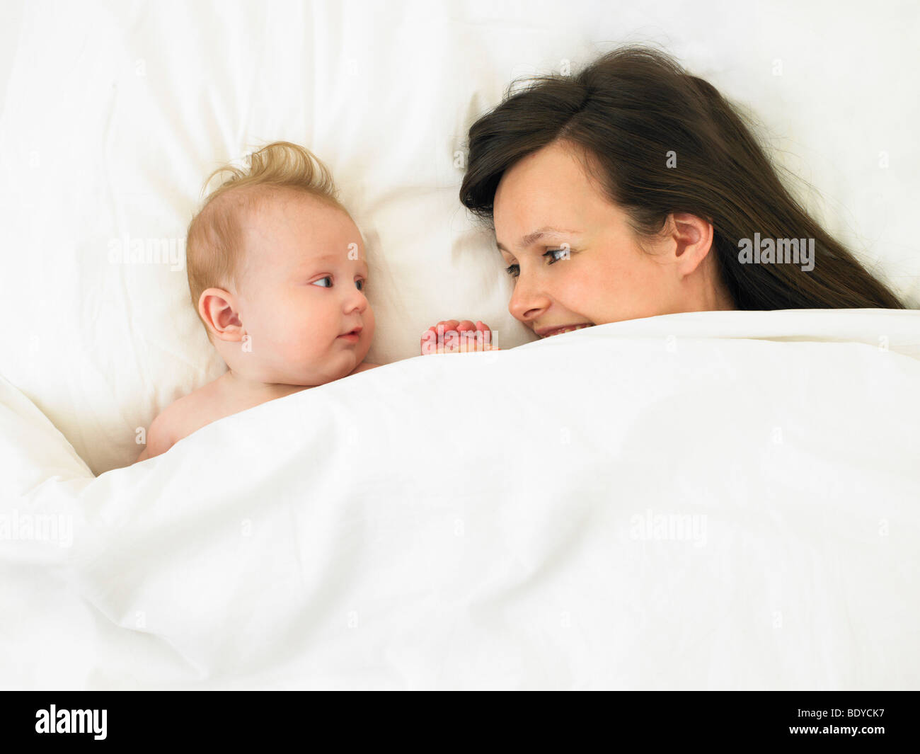 baby and mother in bed Stock Photo - Alamy