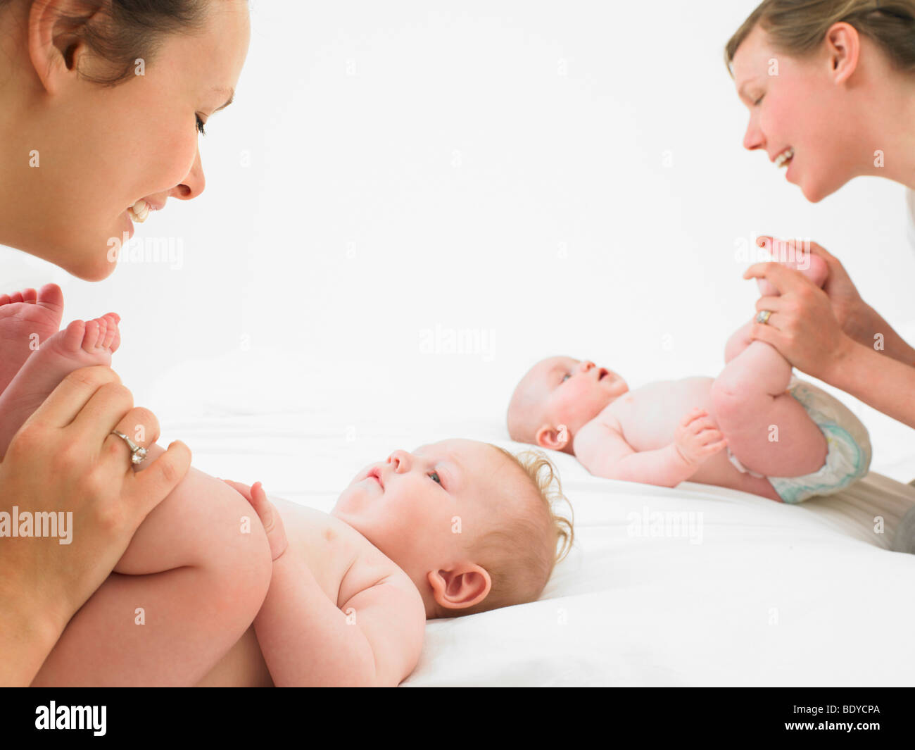 mothers playing with babies Stock Photo - Alamy