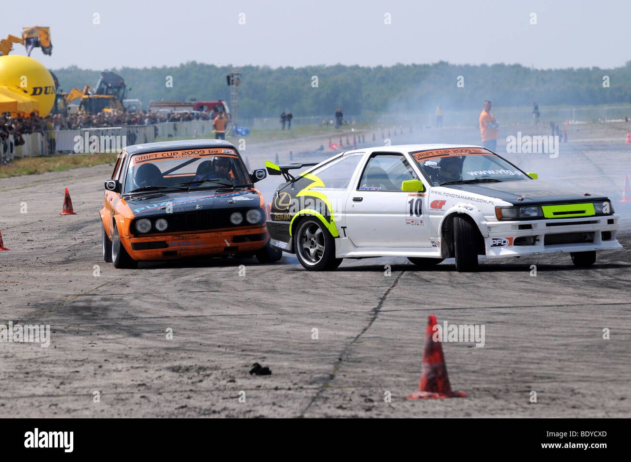 BMW E28 V8 (orange) and Toyota Corolla AE86 (white) during drift race ...