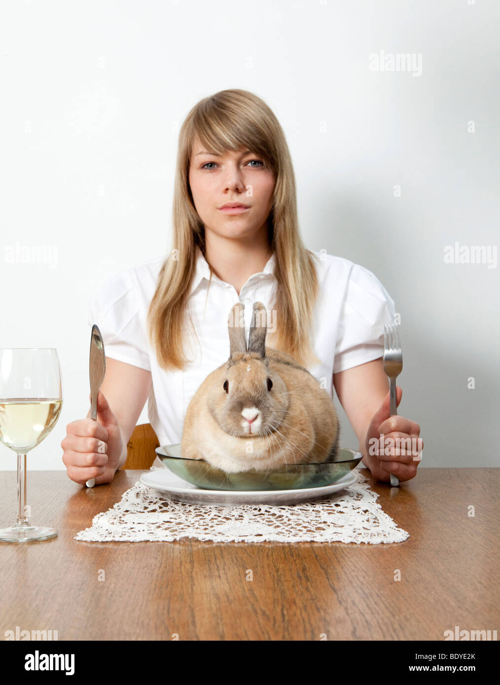 Woman with living rabbit on her plate Stock Photo - Alamy
