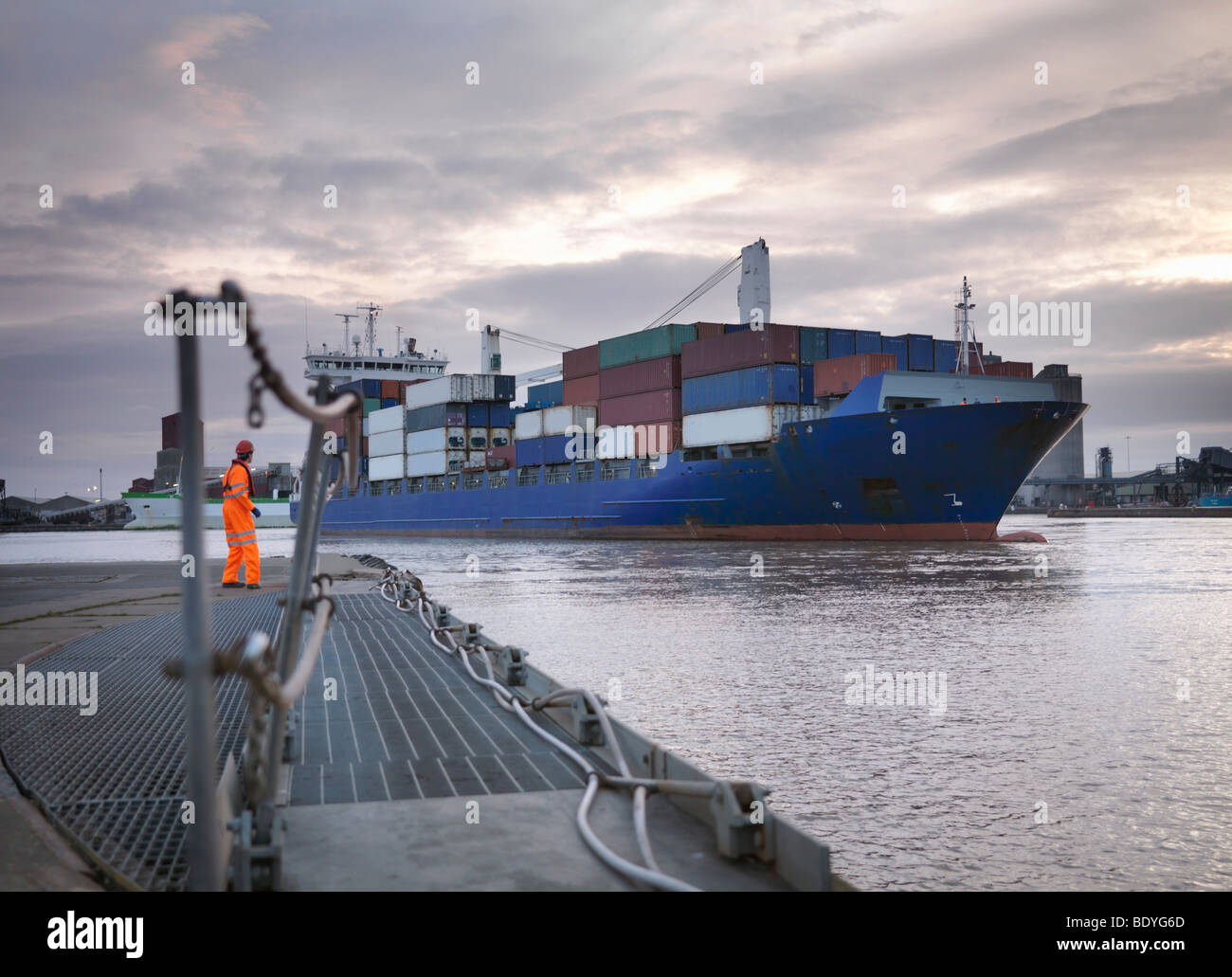 Port worker and ship coming into port hi-res stock photography and ...