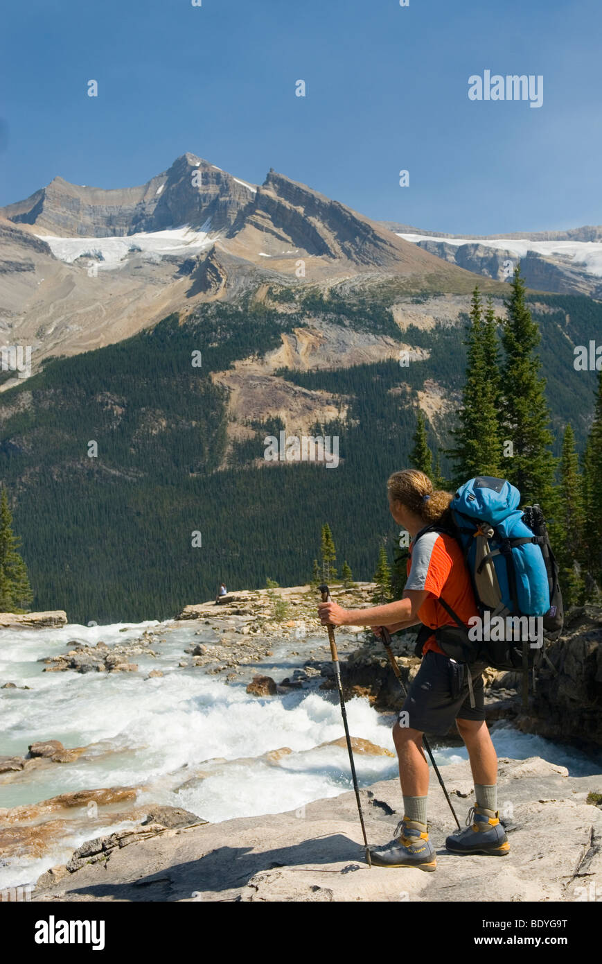 Backpacker at Twin Falls Creek with Mount Balfour in the distance, Yoho ...