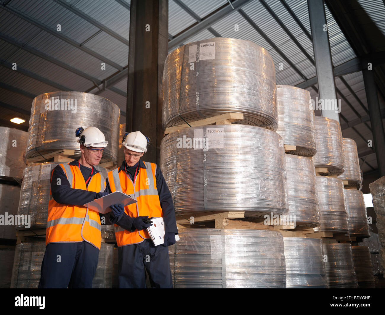 Port Workers Checking Cargo Stock Photo - Alamy