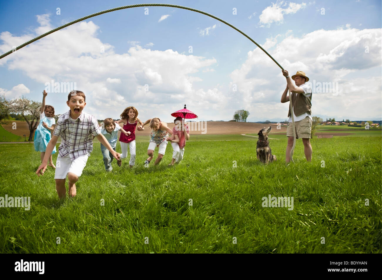 Family having fun in countryside Stock Photo - Alamy