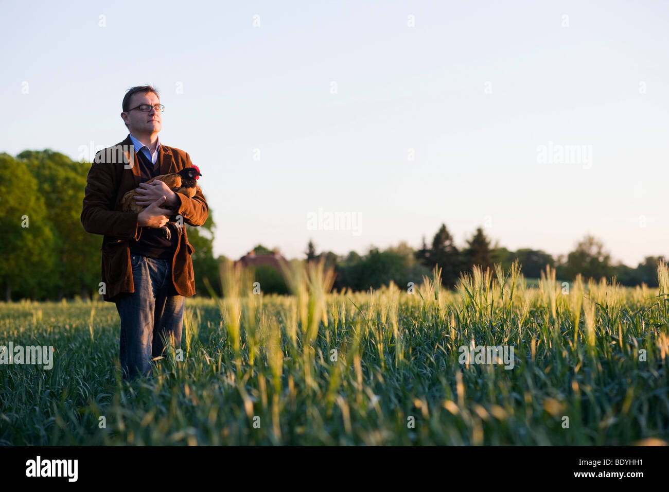 man holding chicken Stock Photo - Alamy