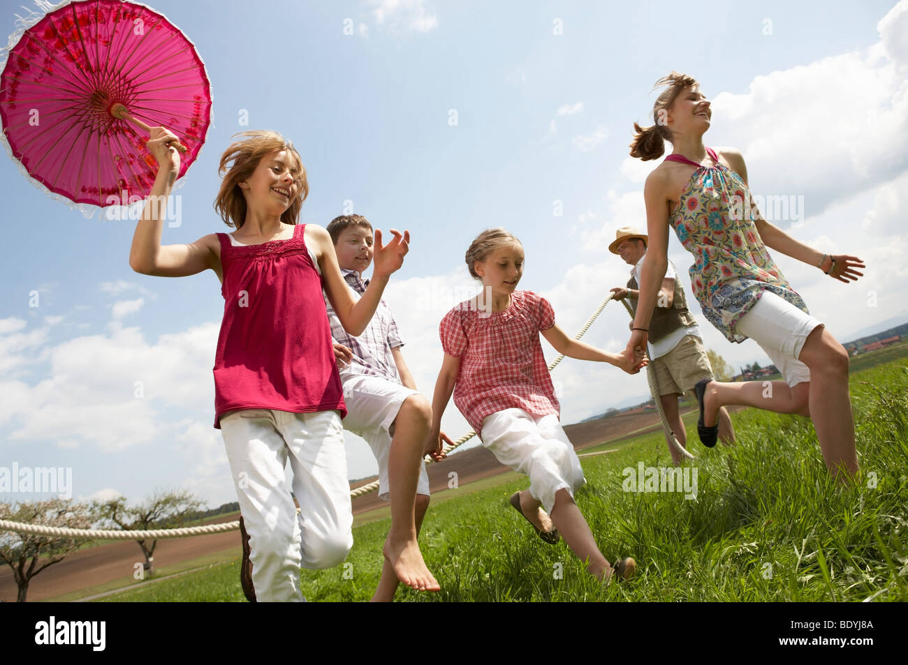 Family having fun in countryside Stock Photo - Alamy