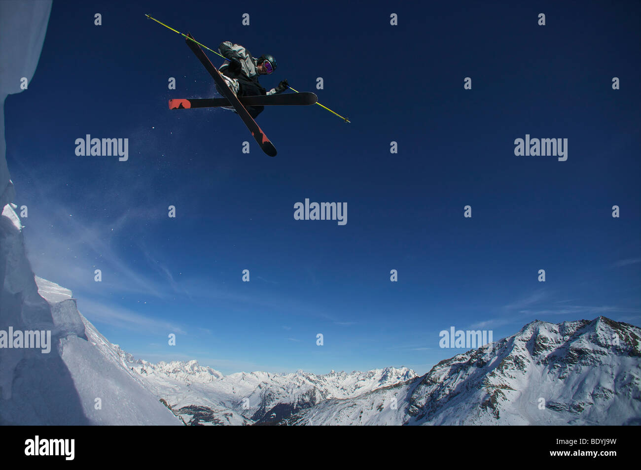Skier jumping into the air Stock Photo - Alamy