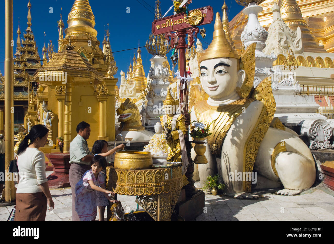 Burmese people sacrificing in front of the Shwedagon Pagoda, Buddhist ...