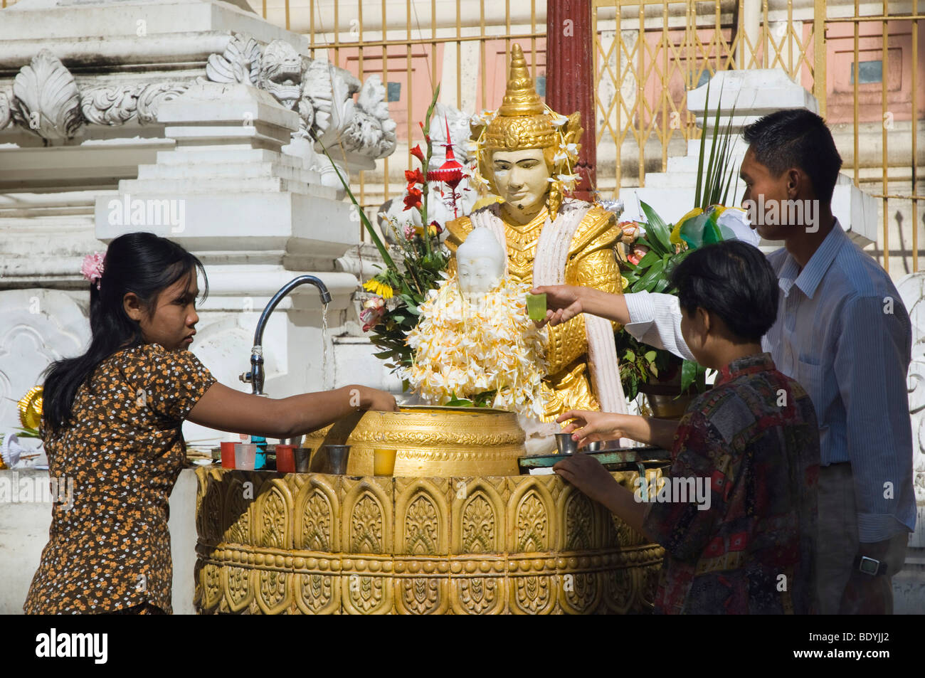 Burmese people sacrificing in front of the Shwedagon Pagoda, Buddhist ...