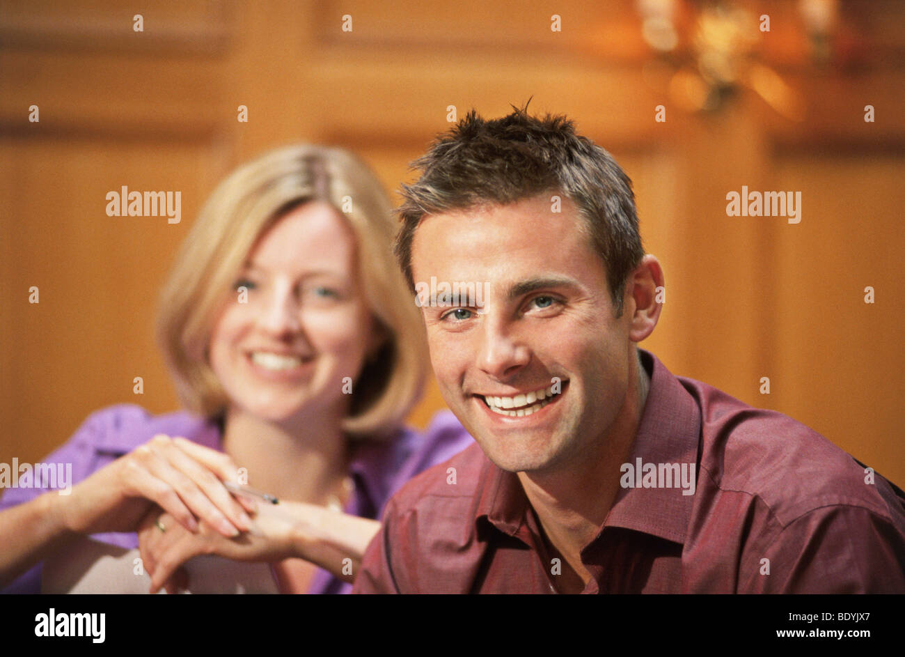 A couple of course mates smiling Stock Photo - Alamy