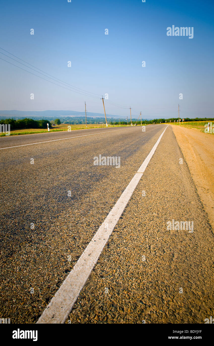 Long road stretching out into the distance Stock Photo - Alamy