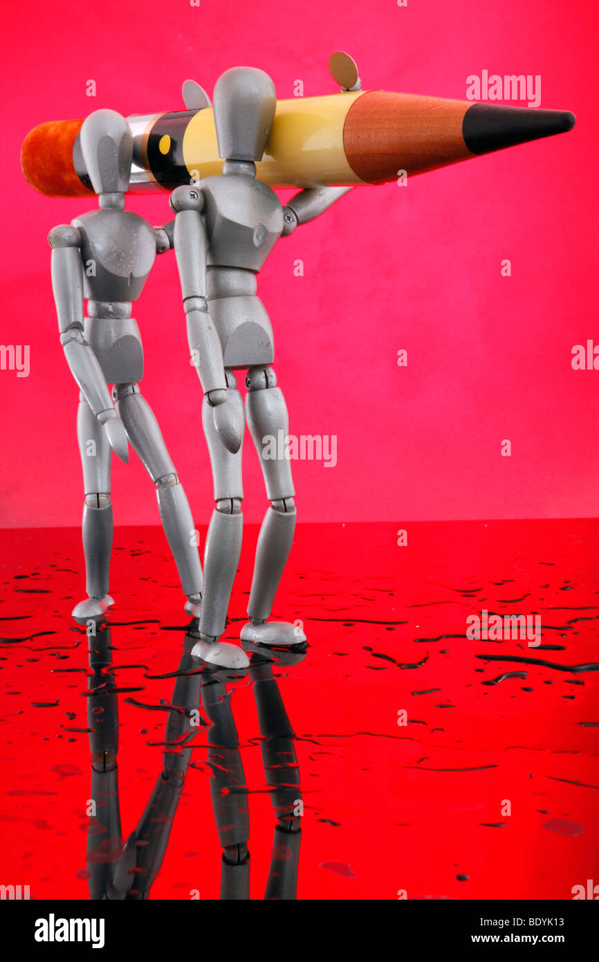 Silver dummies work with a red pencil Stock Photo - Alamy