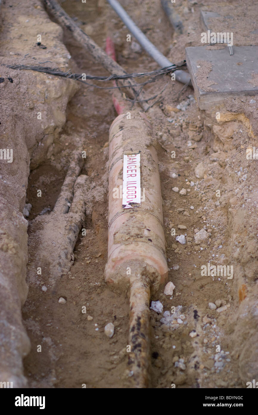roadworks, underground electrical cable 11,000 volt, 11kV, being dug ...