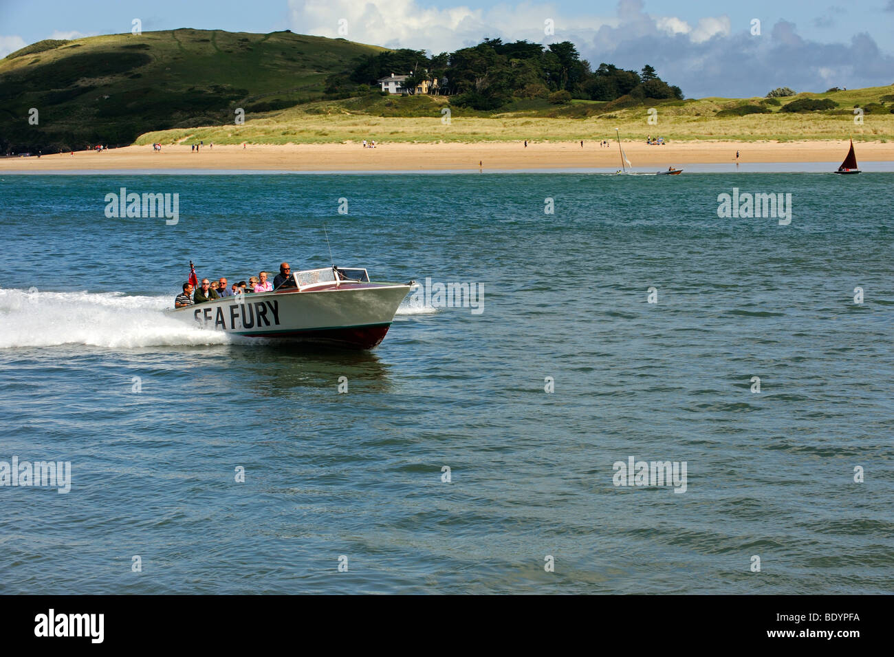 A speed boat taking tourists for a joy ride on the Camel Estuary near ...