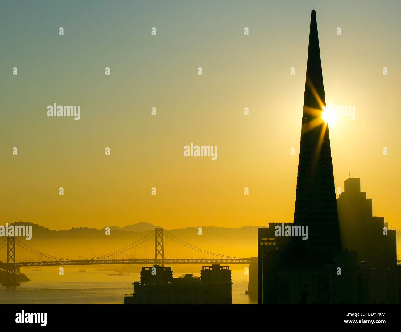 The Transamerica pyramid and bay bridge San Francisco at sun rise Stock ...