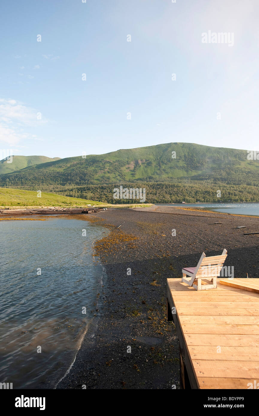 Alaska, A secluded beach with lawn chair to relax in Stock Photo - Alamy
